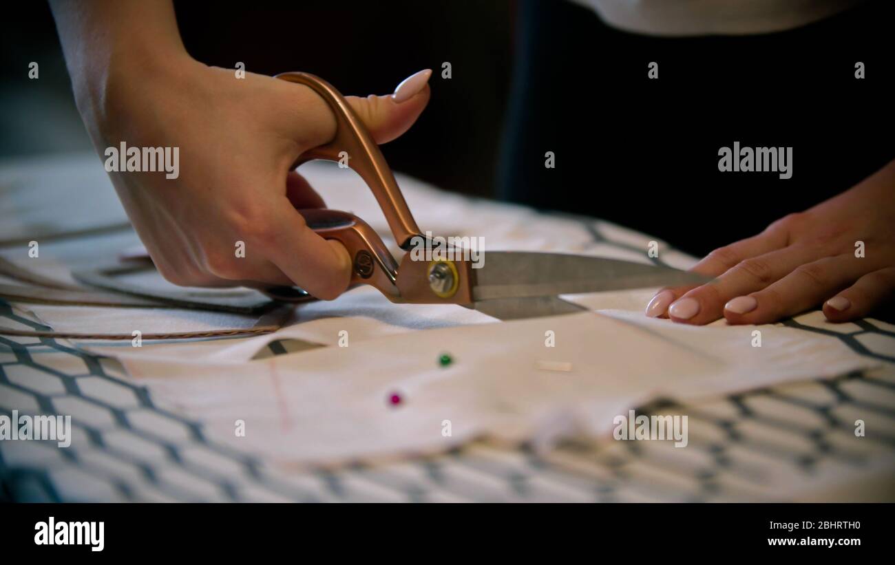 Hand dress making scissors cutting hi-res stock photography and images ...