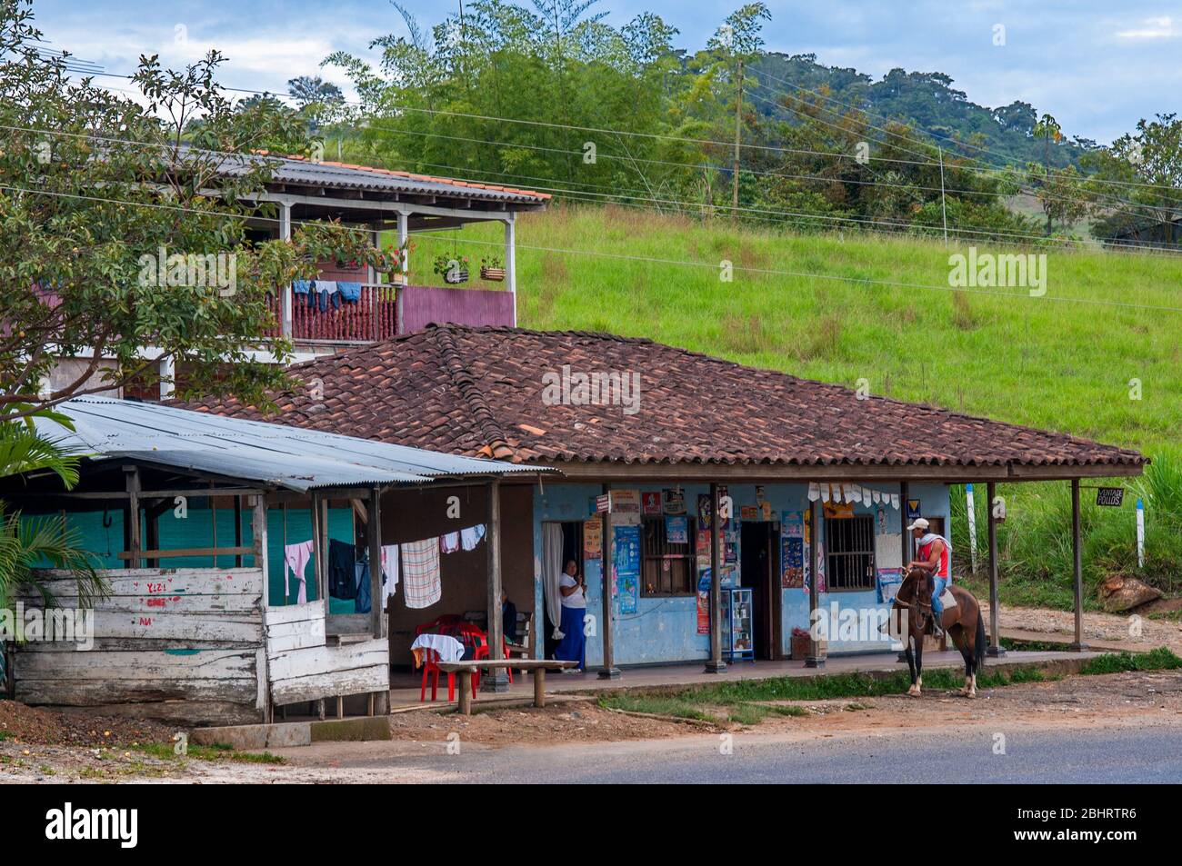 Farm and cowboy near Calima Lake in Darien in the Cauca Valley ...