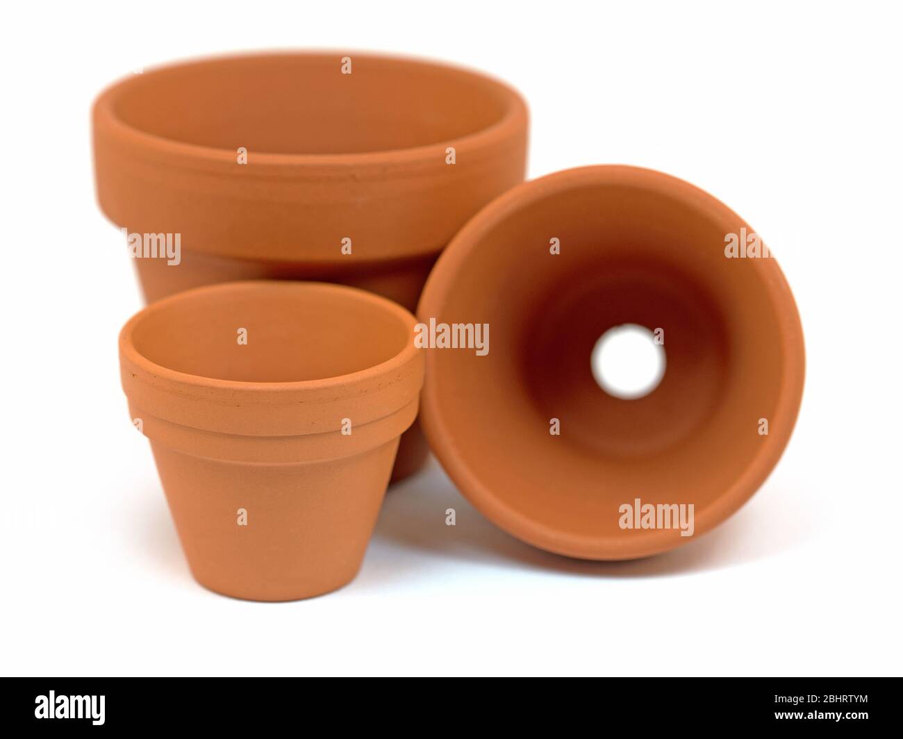 Empty flower pots against white background Stock Photo - Alamy
