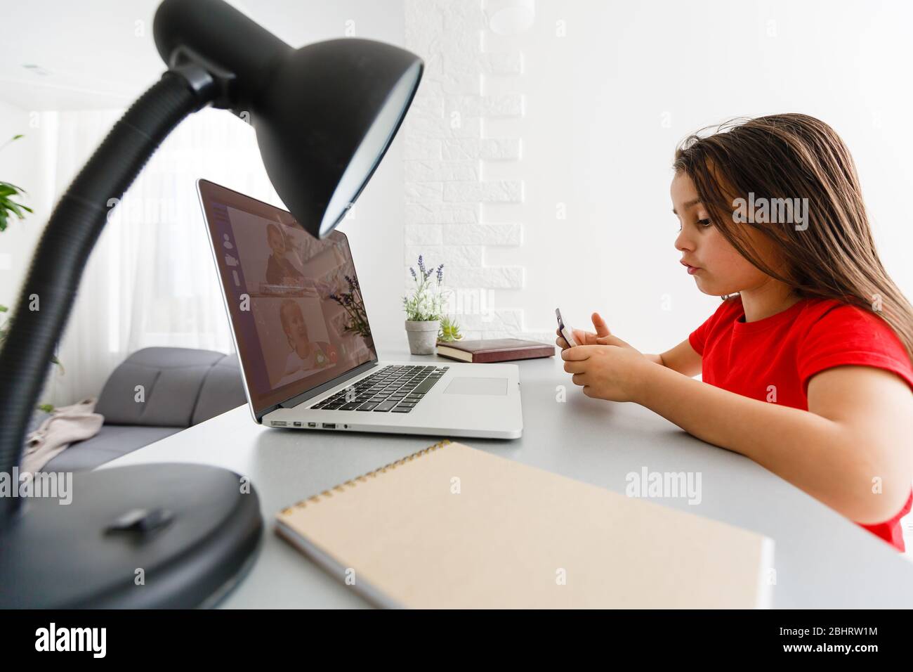 Remote lessons. The child smiles happily and gets knowledge remotely ...