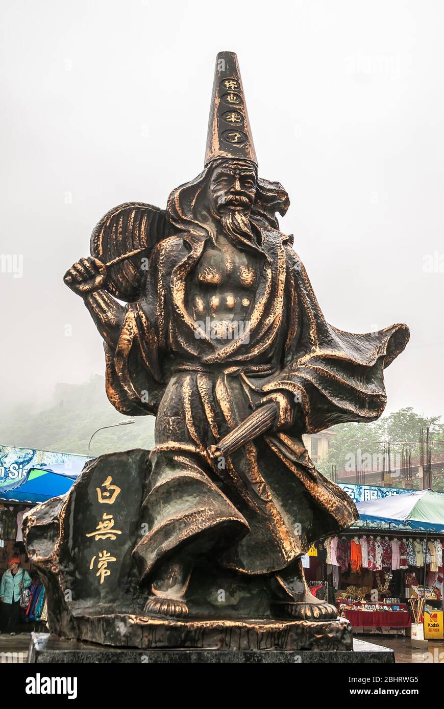 Fengdu, China - May 8, 2010: Closeup of giant black and gold statue of ...