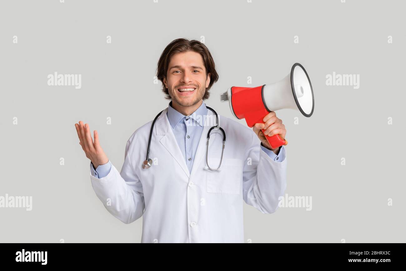 Medical Announcement. Portrait Of Positive Young Doctor With ...