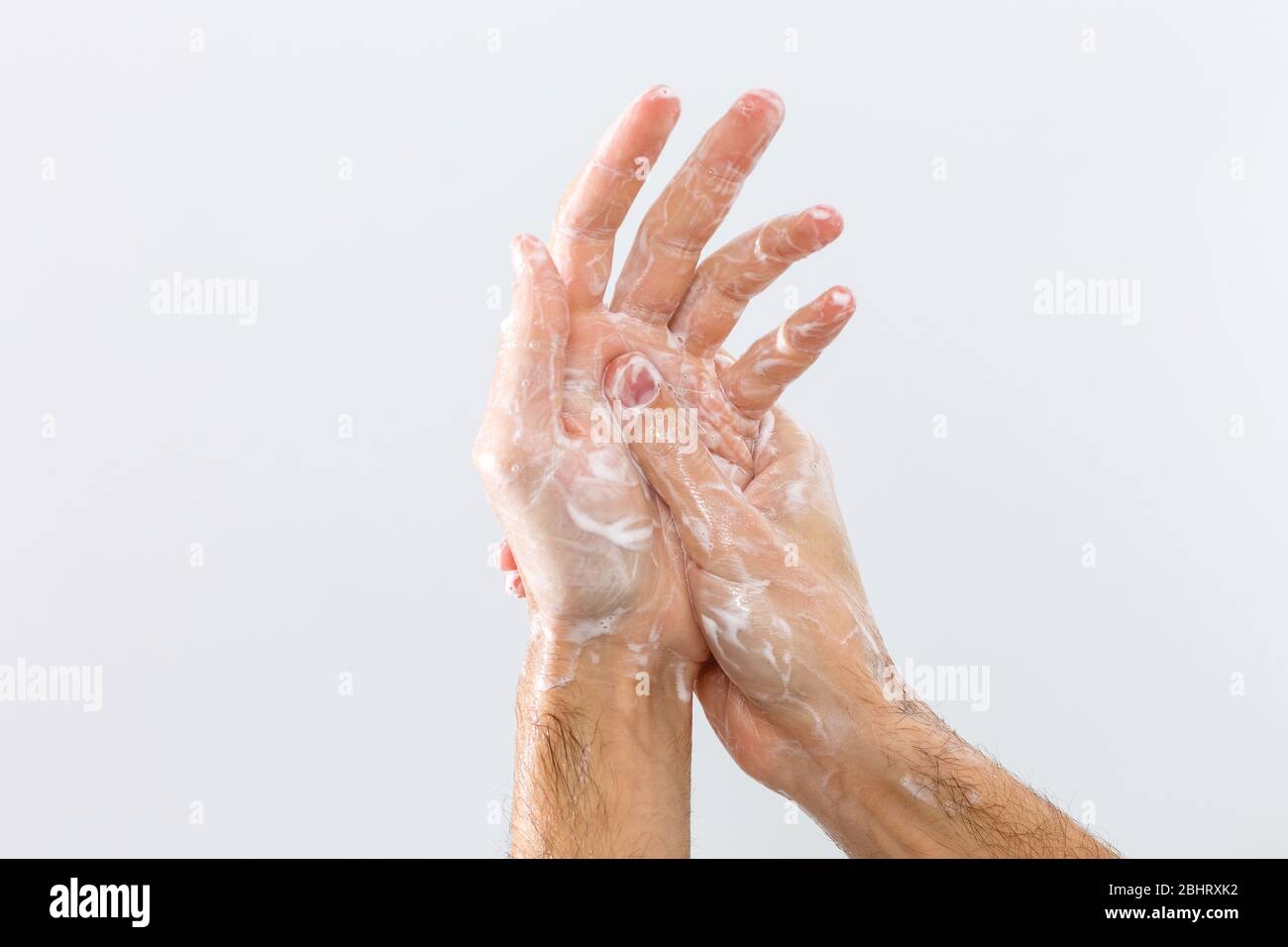 man washing hands isolated over white background Stock Photo - Alamy