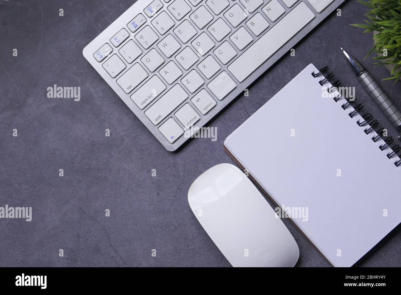 office desk with empty notepad and keyboard Stock Photo - Alamy