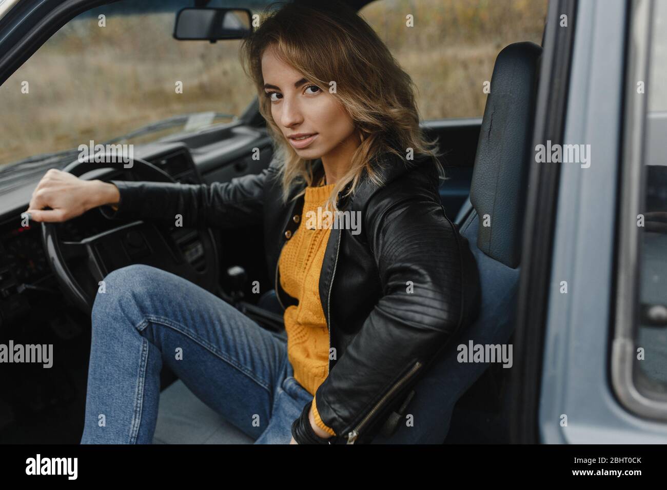 Female model posing car hi-res stock photography and images - Alamy