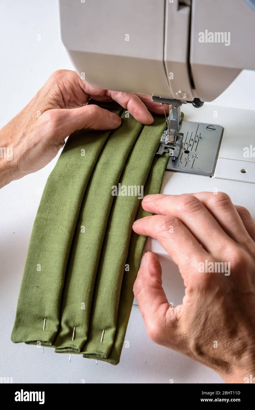 Woman making face masks hi-res stock photography and images - Alamy