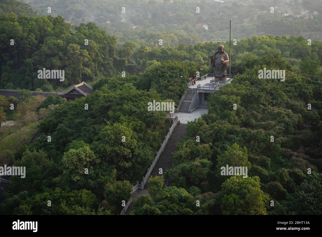 Scenic Landscape with Buddah statue among the trees Stock Photo - Alamy