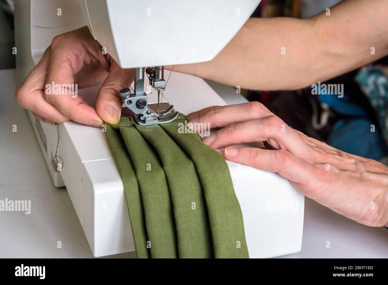 Woman making face masks hi-res stock photography and images - Alamy