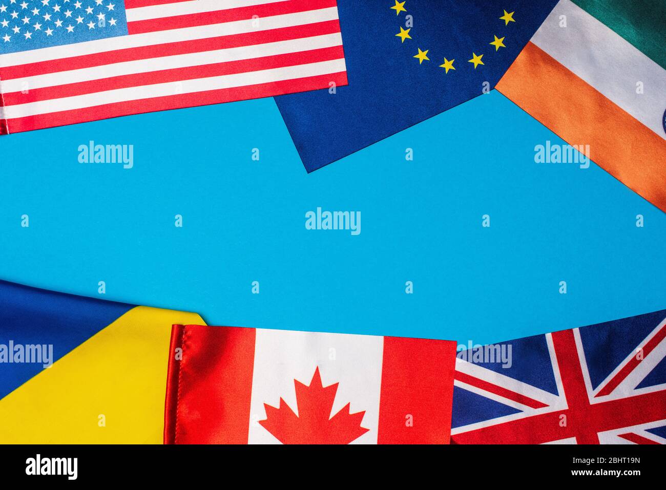 Top view of flags of countries on blue background Stock Photo - Alamy