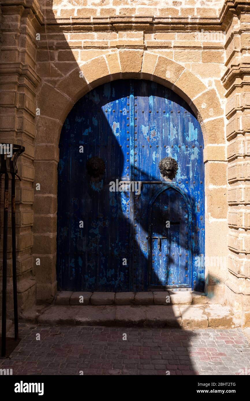 Street of the Atlantic ocean coast town, with a traditional gate with ...