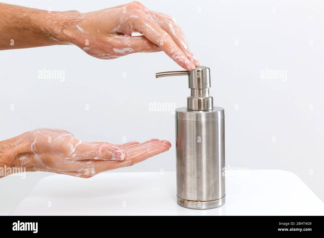 Close up image of washing hand against white background Stock Photo - Alamy