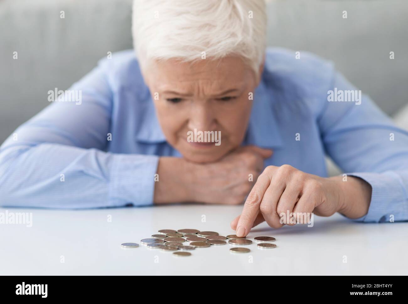 Poor woman counting money hi-res stock photography and images - Alamy