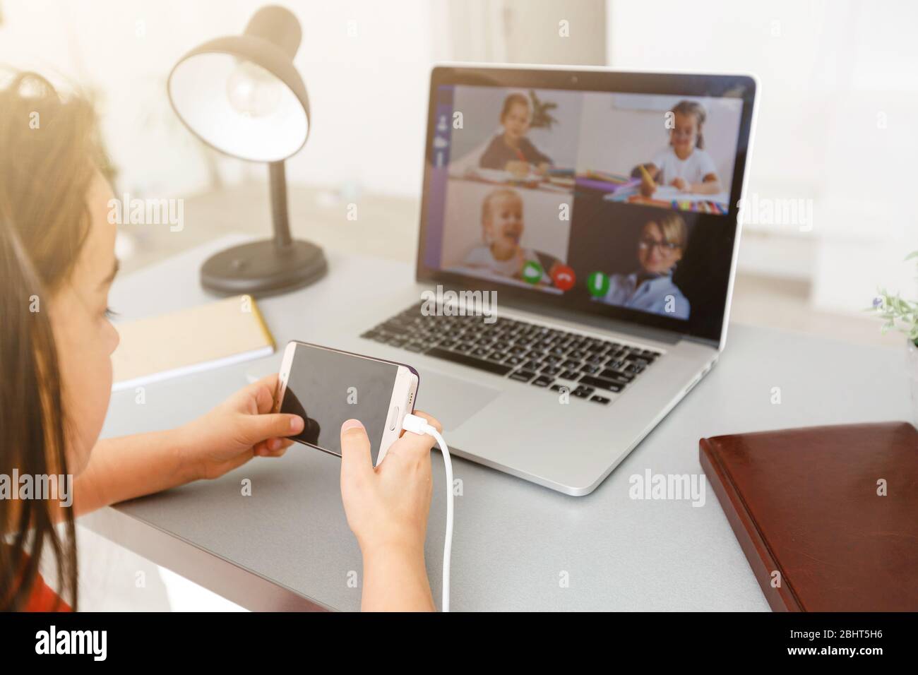 Remote lessons. The child smiles happily and gets knowledge remotely ...