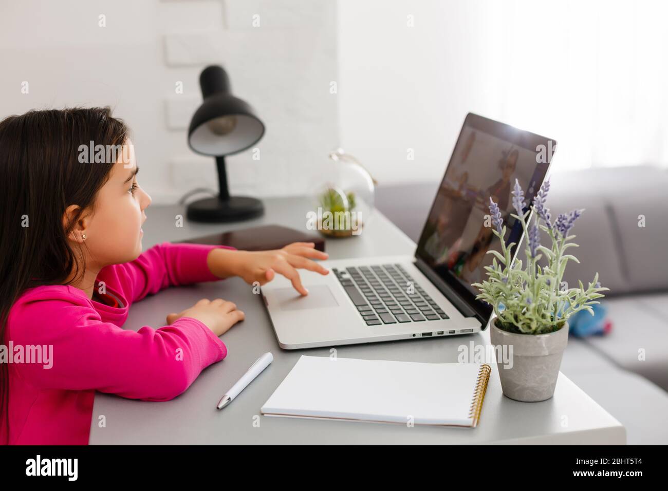 Remote lessons. The child smiles happily and gets knowledge remotely ...