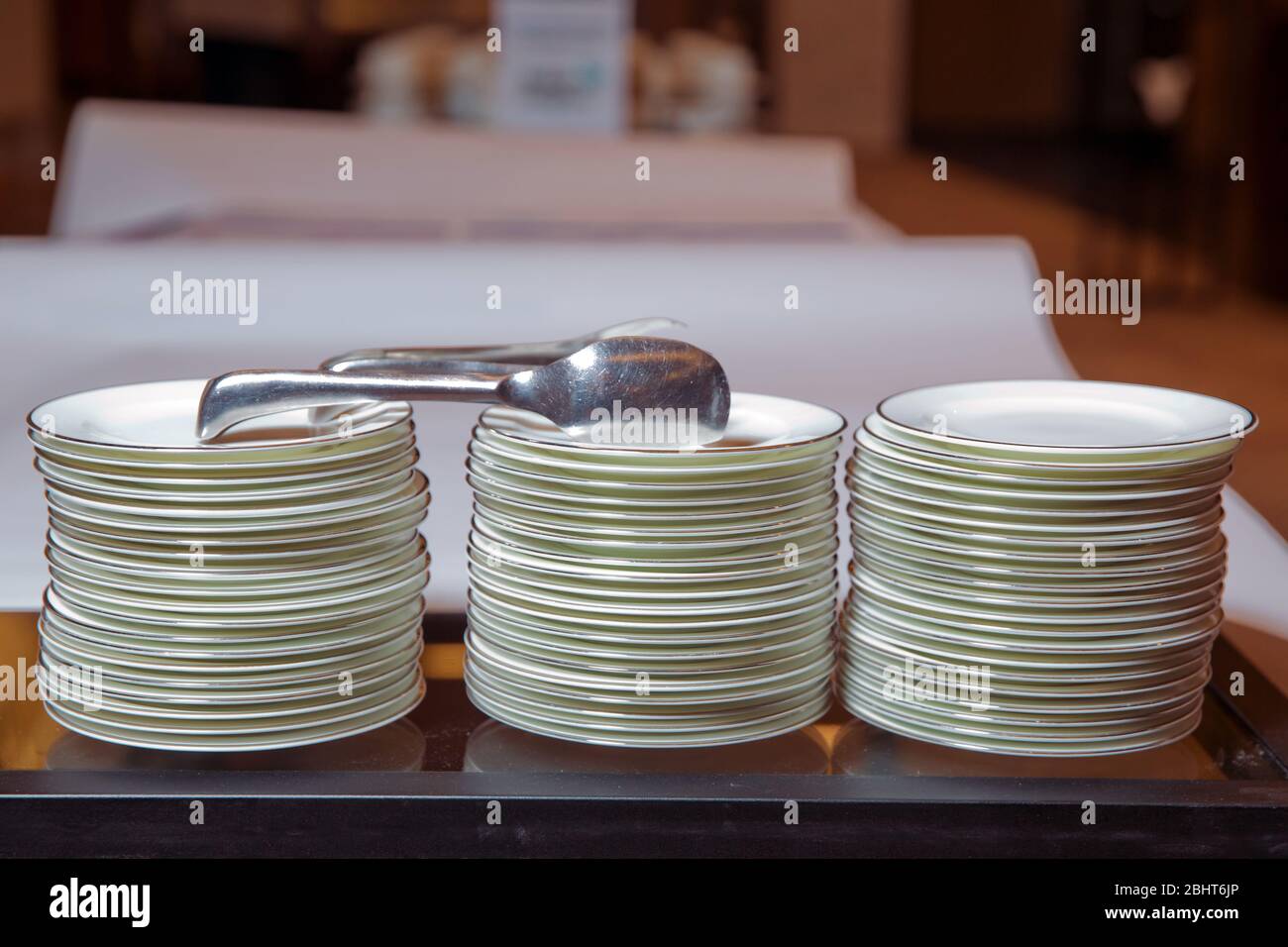 Group of white plates stacked together . white, empty restaurant plates ...