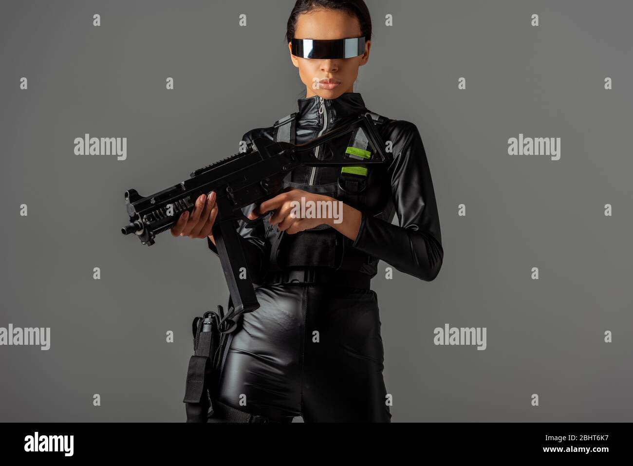 attractive futuristic african american woman in glasses with assault ...