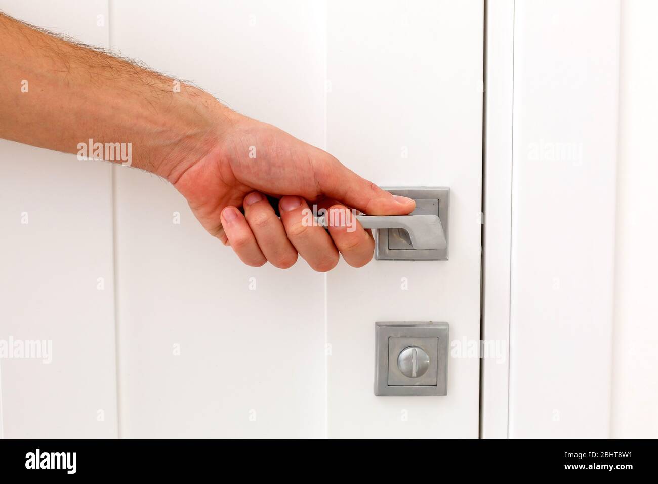 hand opens the door handle Stock Photo - Alamy