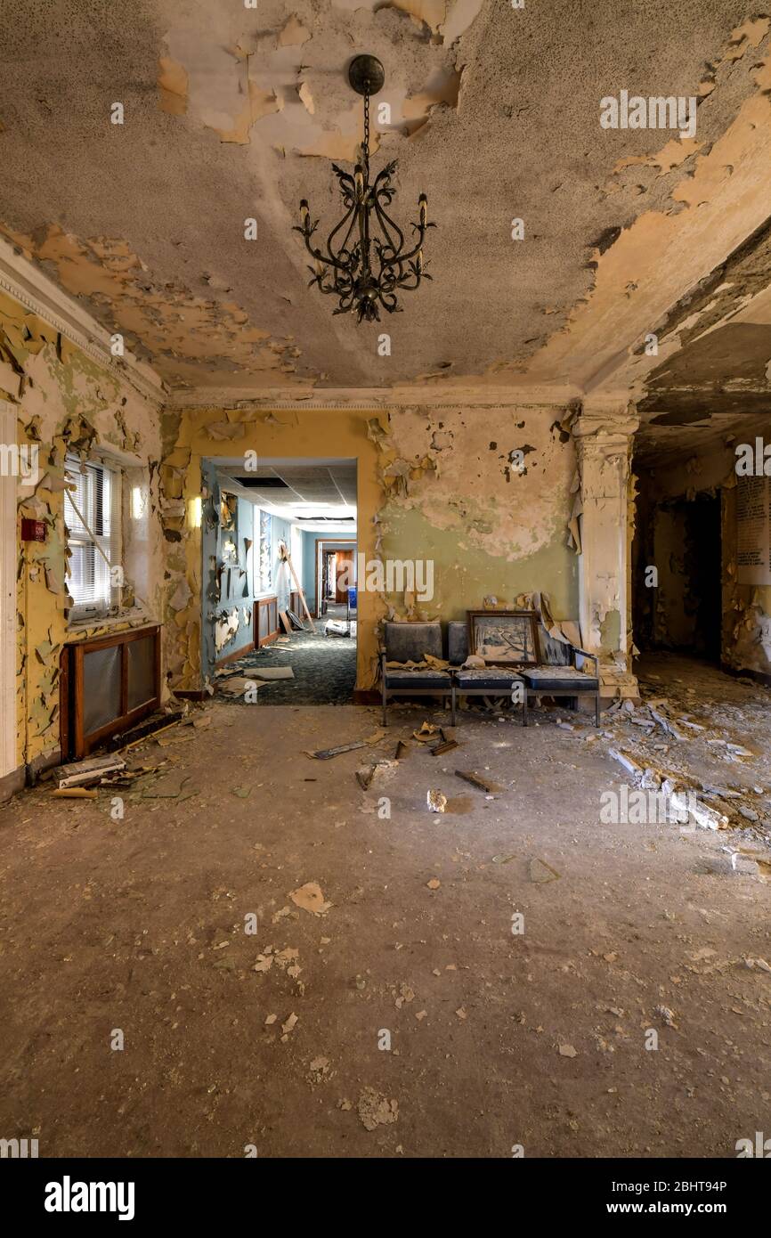 Entryway with seating and chandelier in an Abandoned Hospital Stock ...