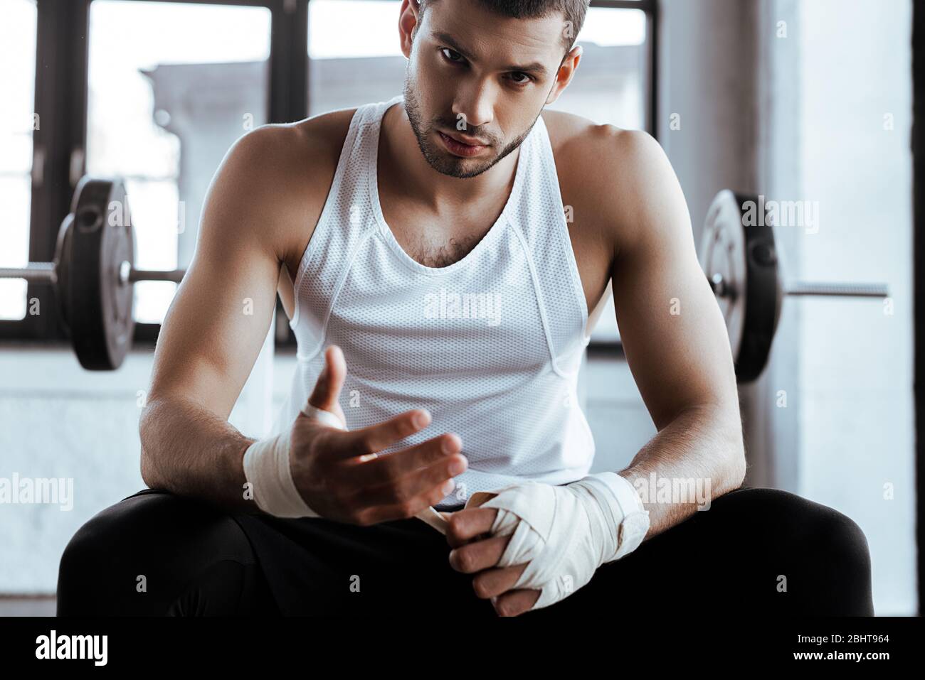 Handsome sportsman wrapping hand hi-res stock photography and images ...