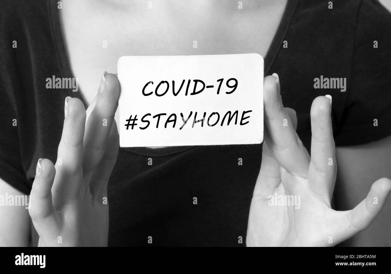 Woman holding the stay home paper Stock Photo - Alamy