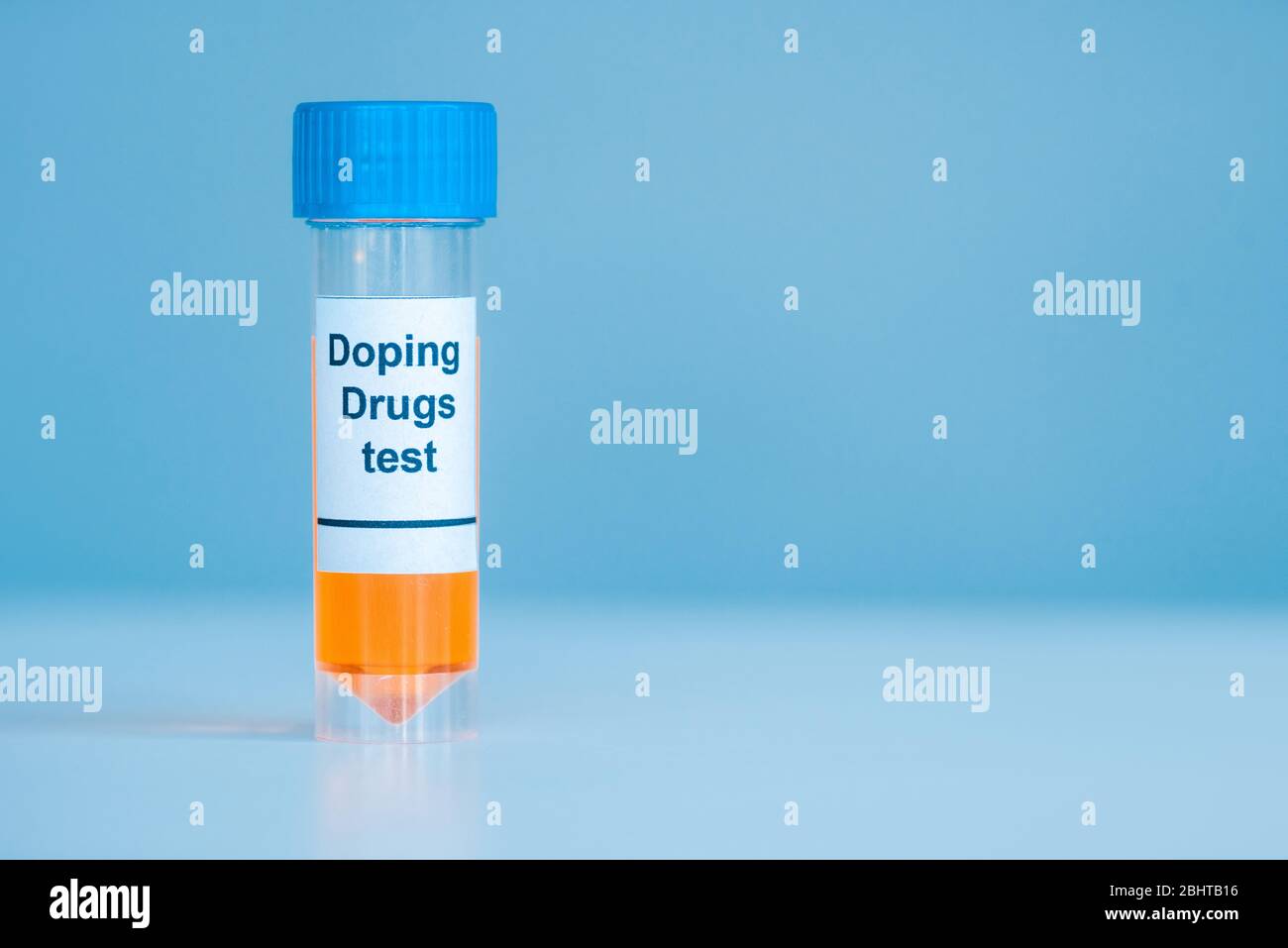 container with urine sample and doping drugs test lettering on blue ...