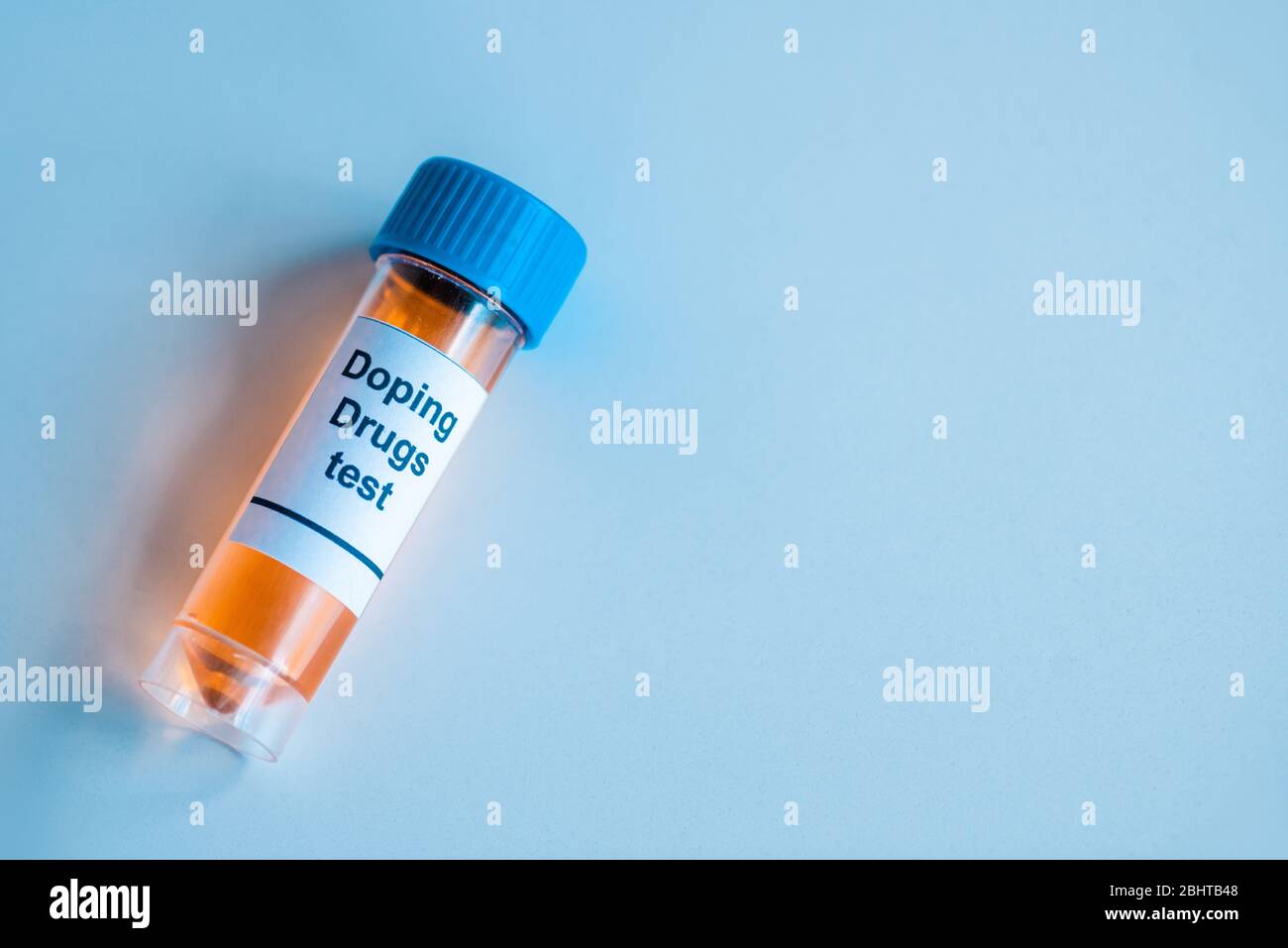 top view of container with sample and doping drugs test lettering on ...