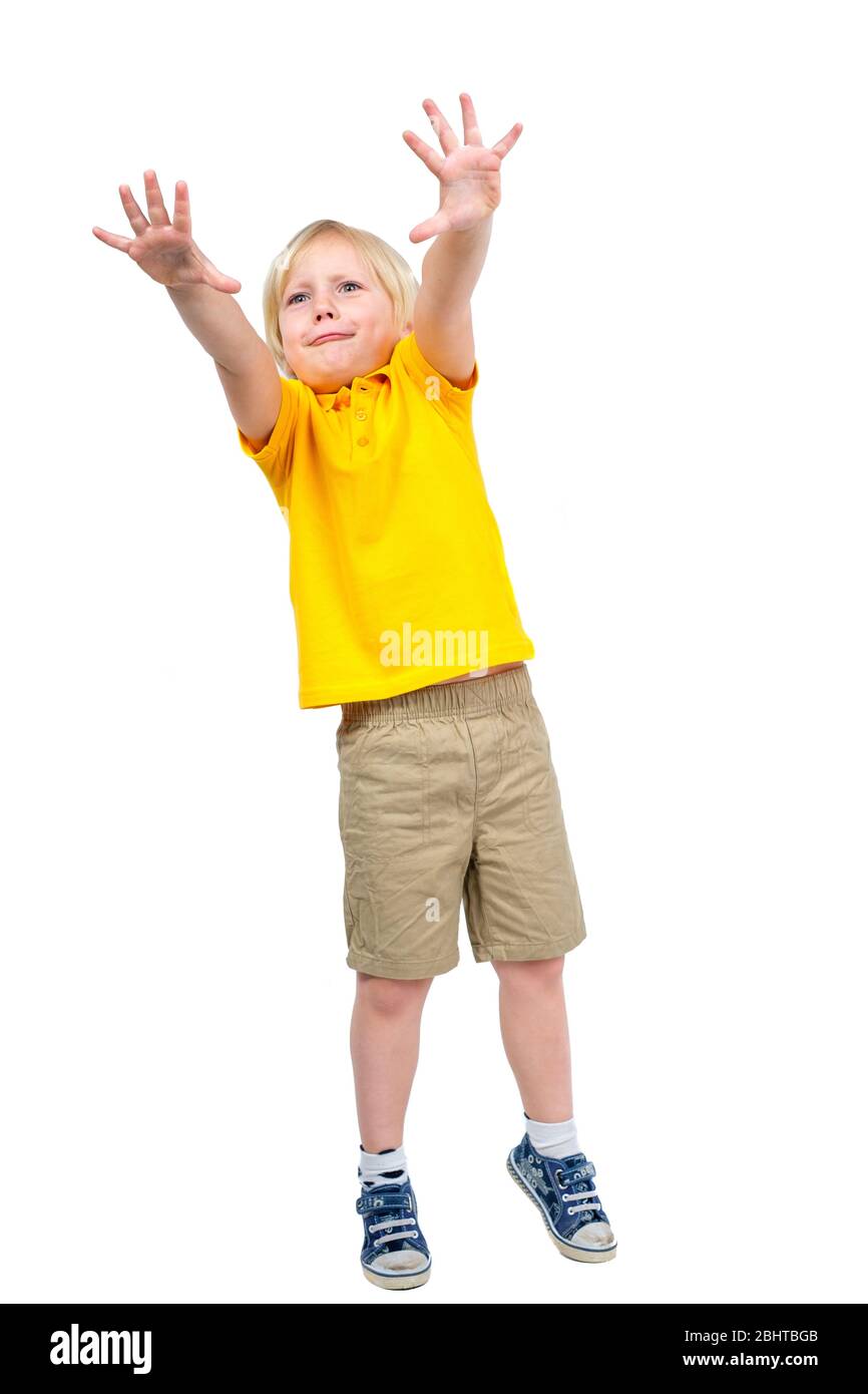 Boy stretched his arms up desperately making reaching Stock Photo - Alamy