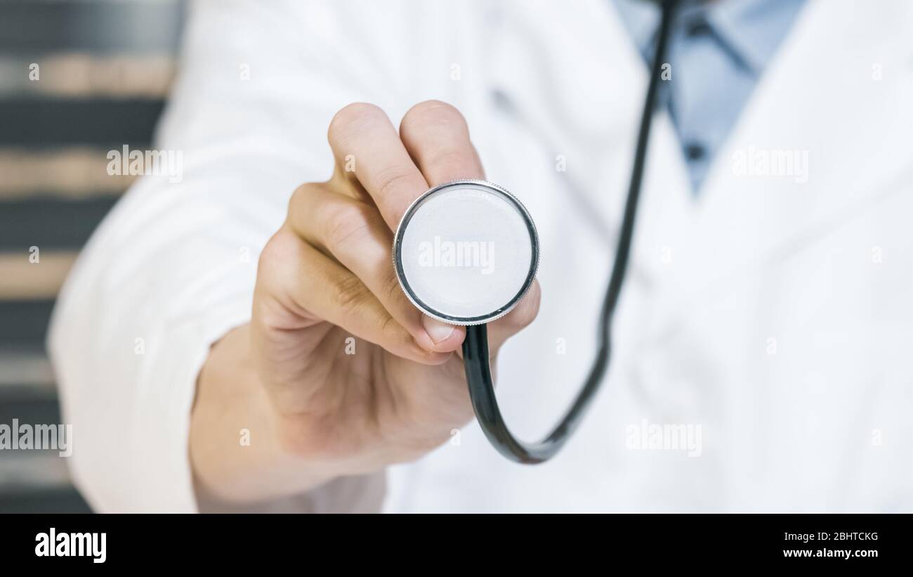 Doctor holding hospital patient hand hi-res stock photography and ...