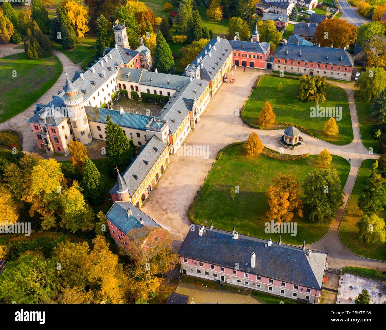 Impressive view of Sychrov castle buildings and park at sunny day ...