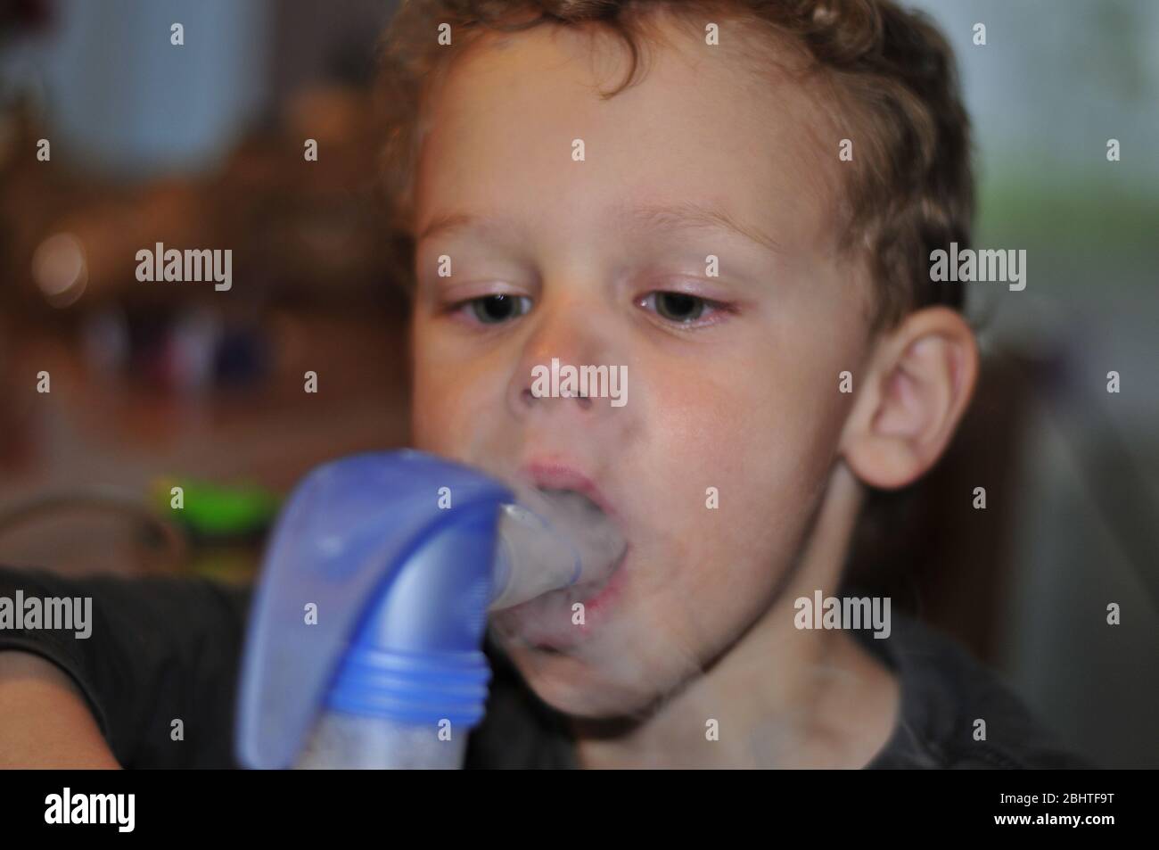 Child inhales with water vapor inhaler Stock Photo - Alamy