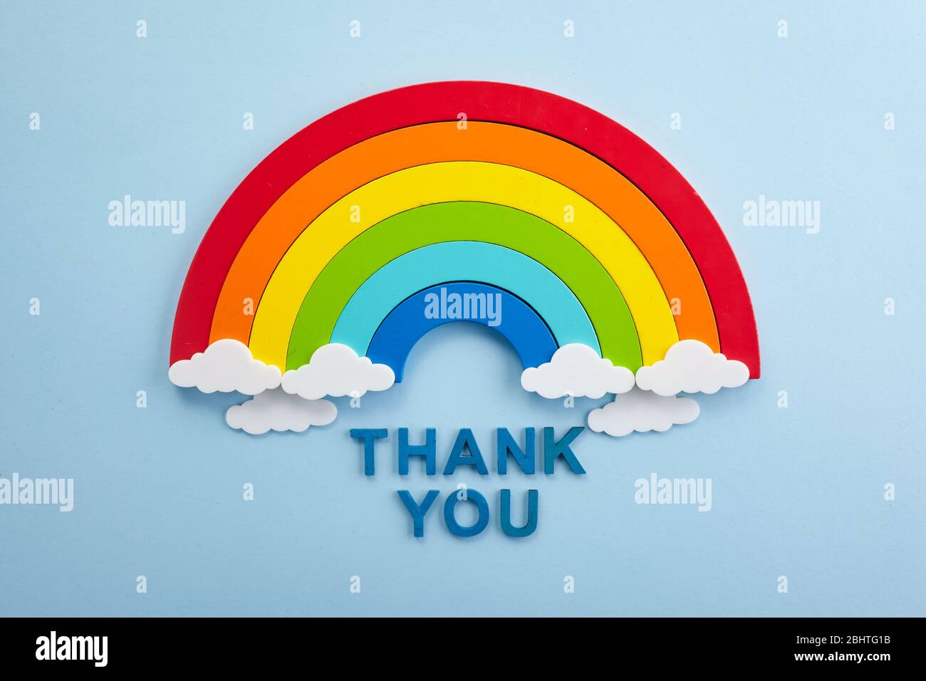 Thank you rainbow banner. Rainbow ob blue background with letters Stock ...