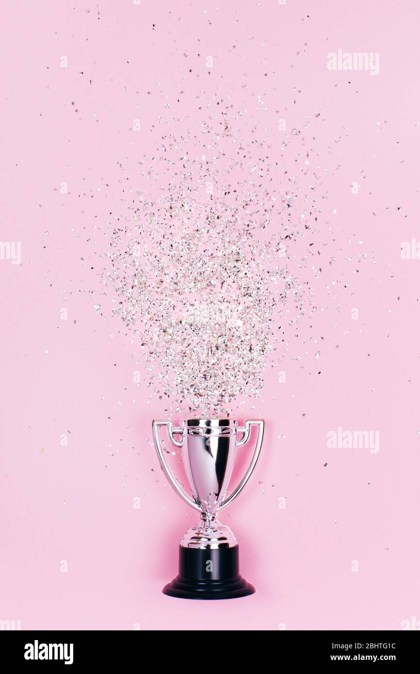 One silver winners cup with sparkles on a pastel background. Banner ...