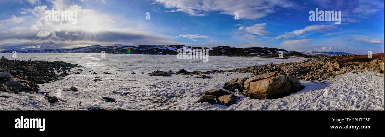 Panoramic freezing lake Stock Photo - Alamy