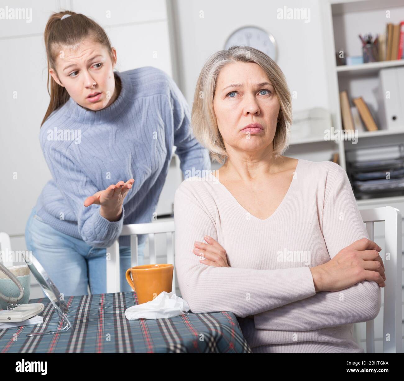 Adult daughter scolds mature mother Stock Photo - Alamy