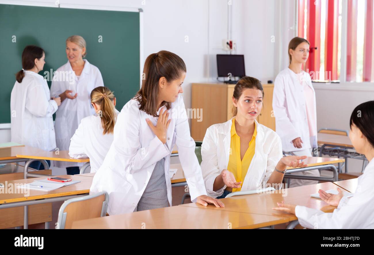 Medical students talking and having fun, spending time together during ...