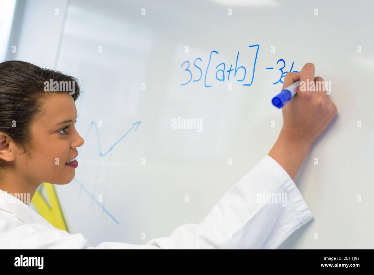 woman during a math lesson Stock Photo - Alamy