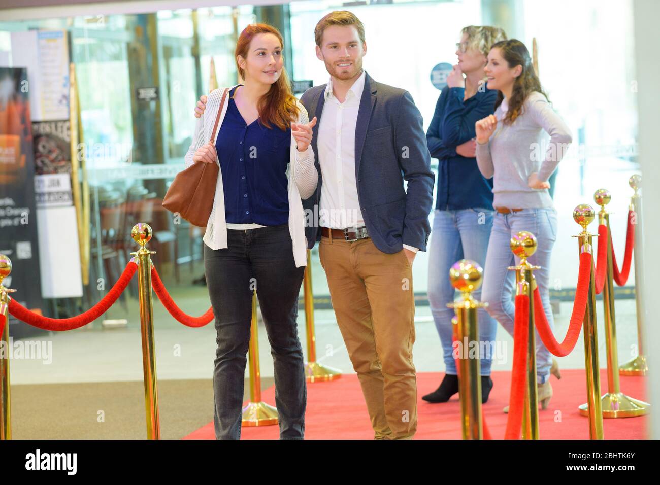 couple in cinema lobby Stock Photo - Alamy
