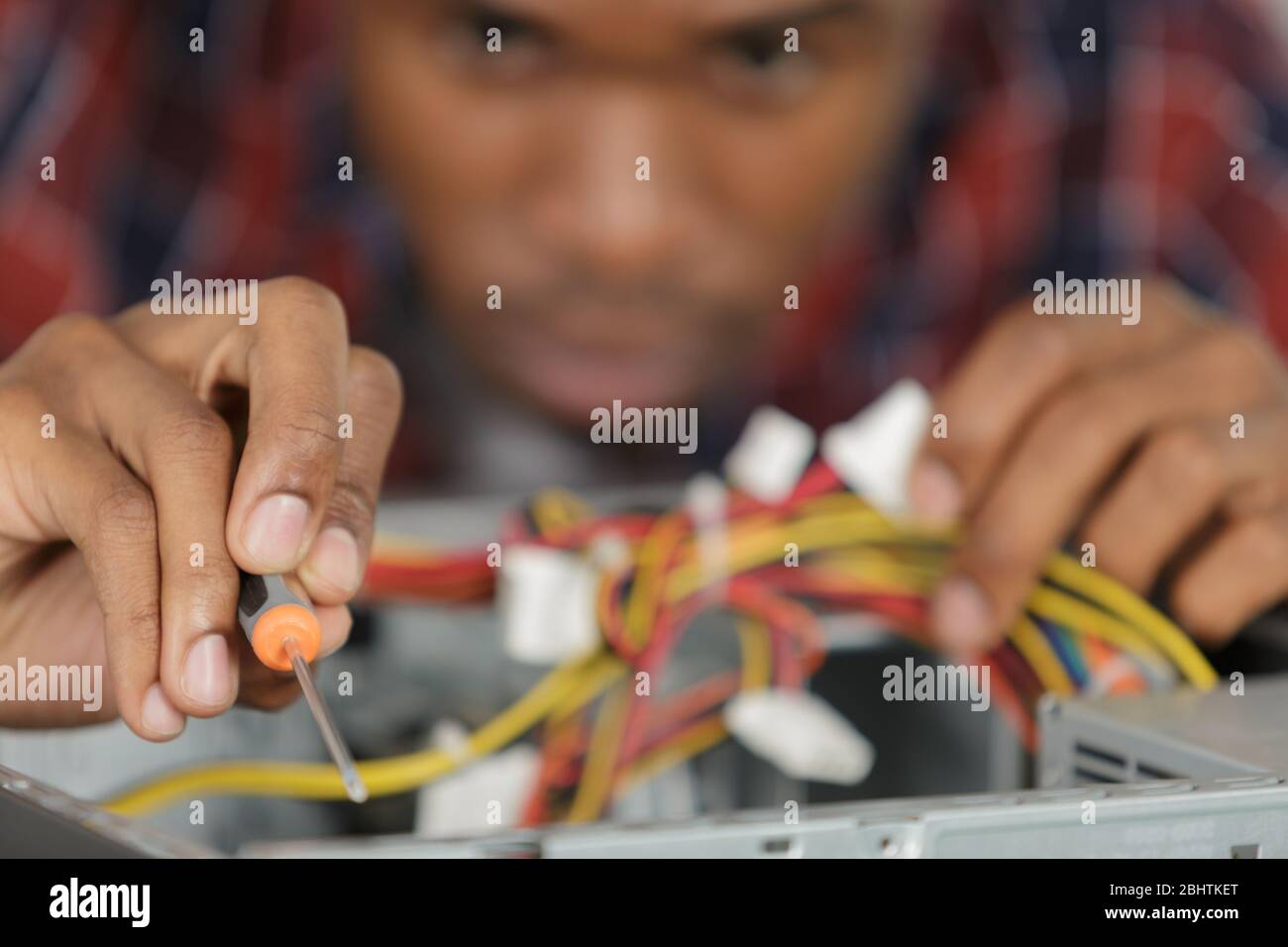 computer engineer connecting a cable Stock Photo - Alamy