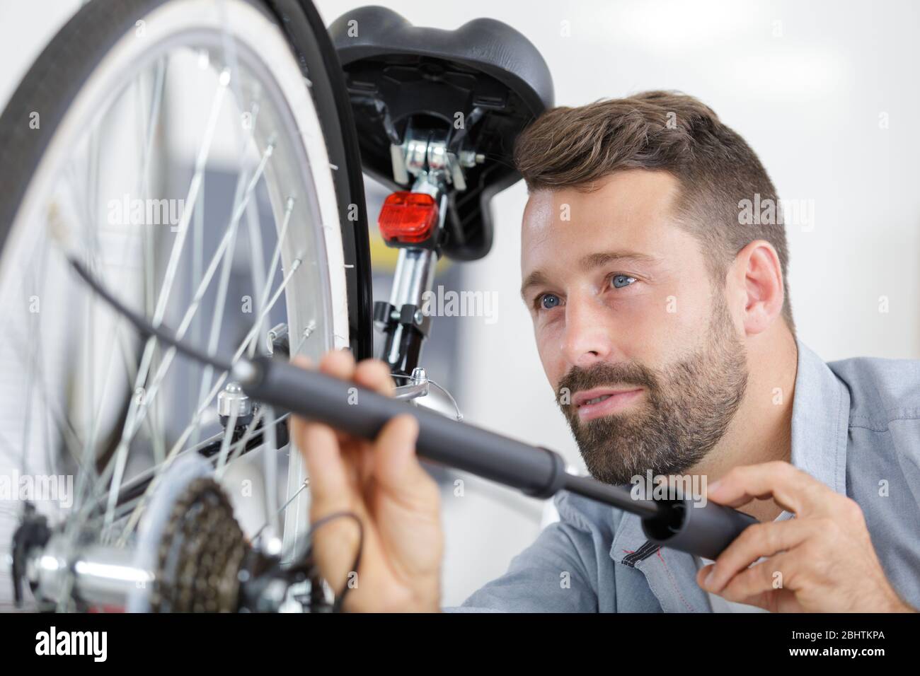 Man inflating bicycle tire pump hi-res stock photography and images - Alamy