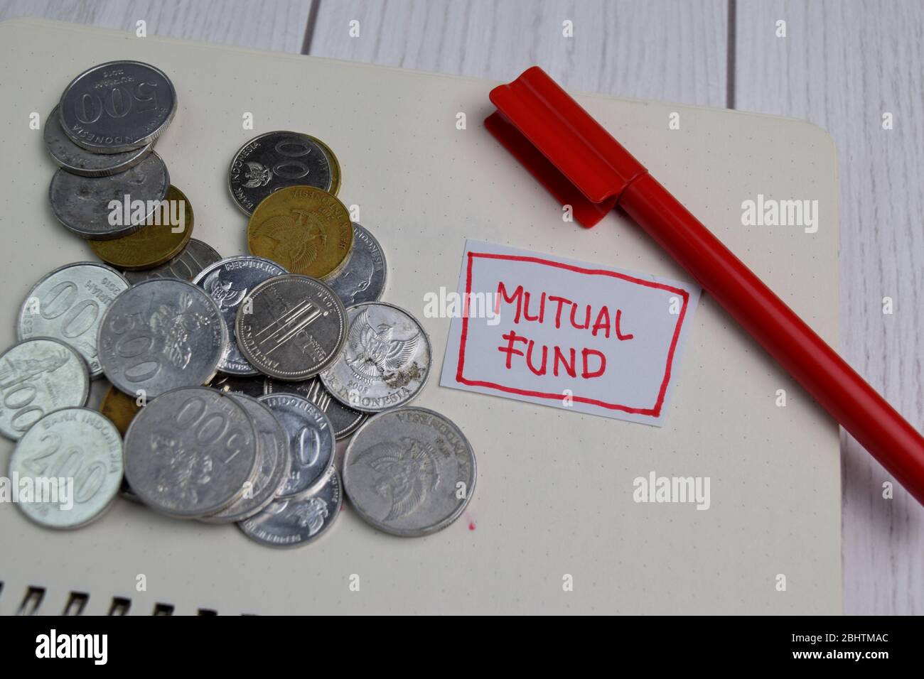 Mutual Fund write on sticky notes and coins isolated on office desk ...