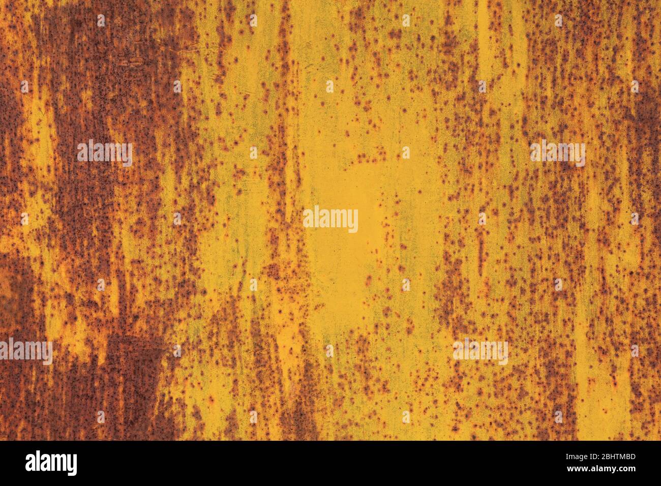 Metallic wall background, texture, colored in fiery yellow color. Old ...