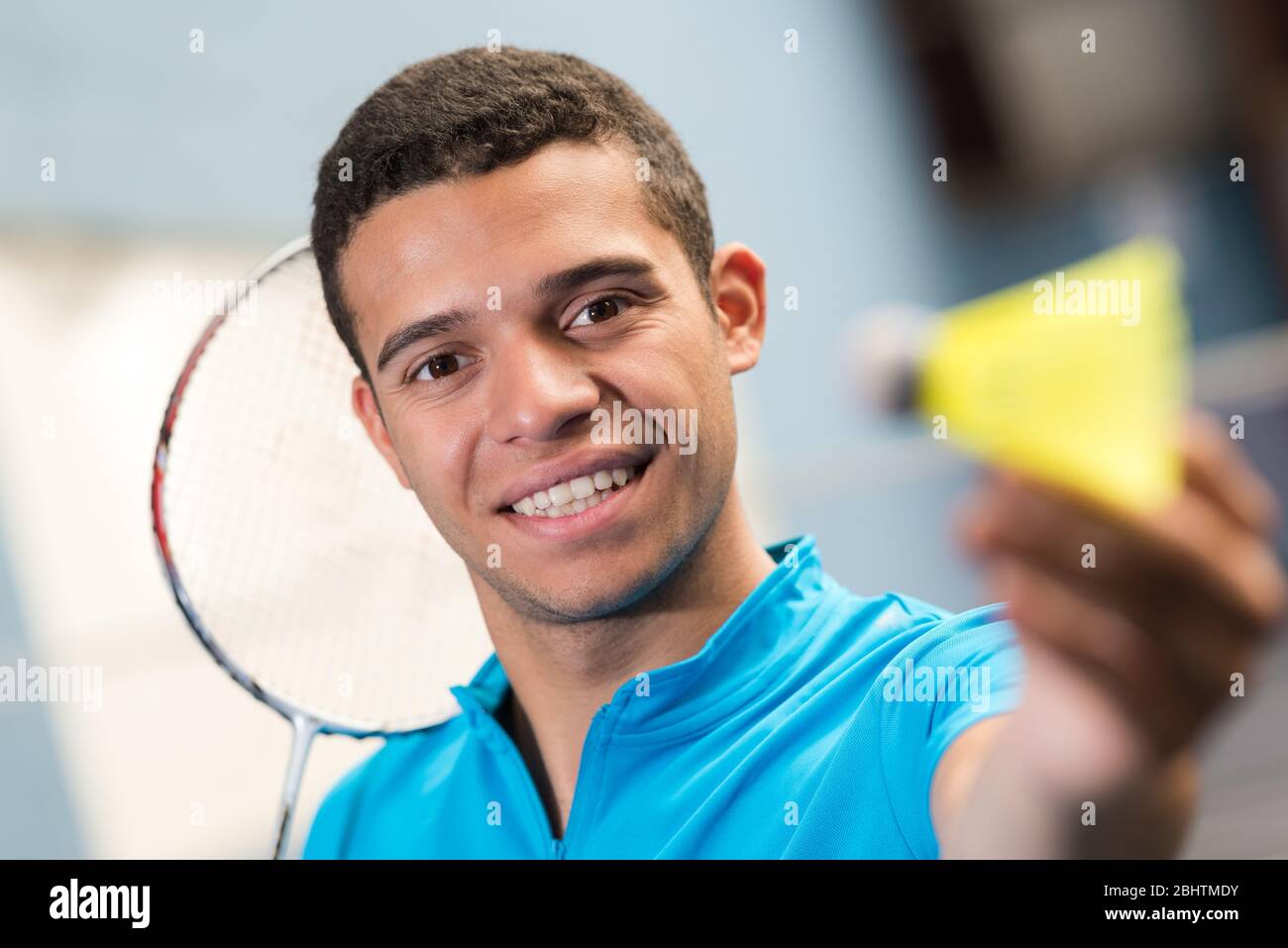 badminton player showing a shuttlecock Stock Photo - Alamy