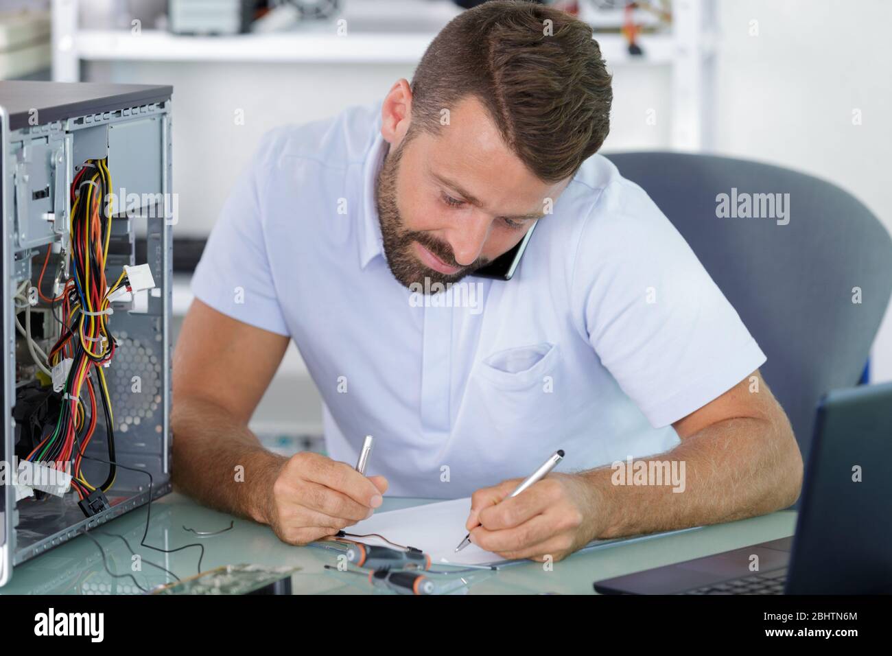 angry customer trying to repair computer with phone support Stock Photo ...