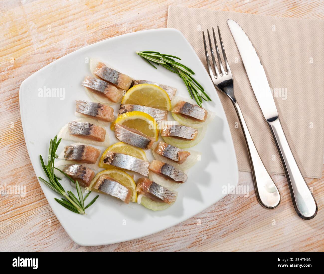 Marinated herring fillet with sliced onion and lemon, healthy food ...