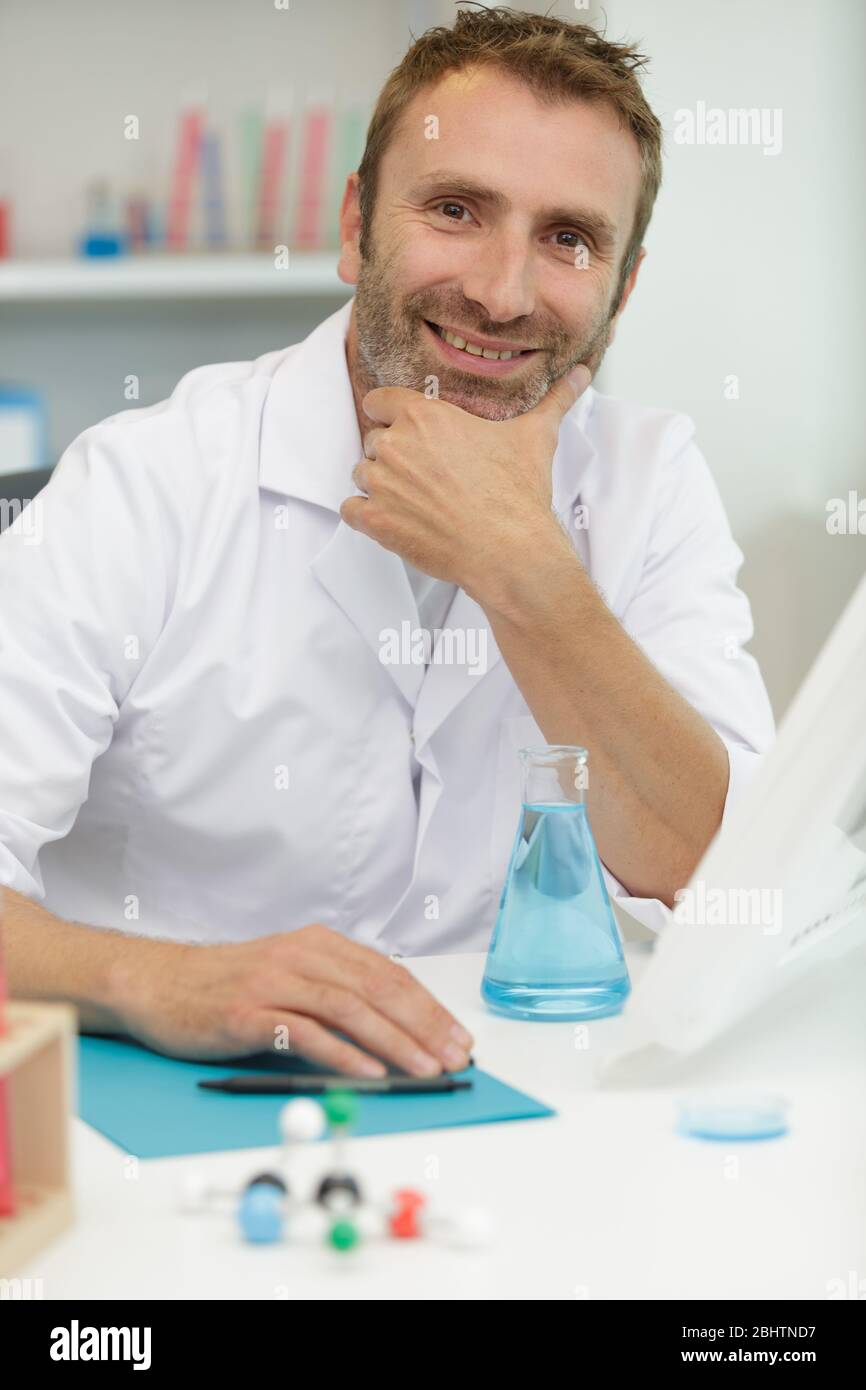 a smiling scientist in laboratory Stock Photo - Alamy