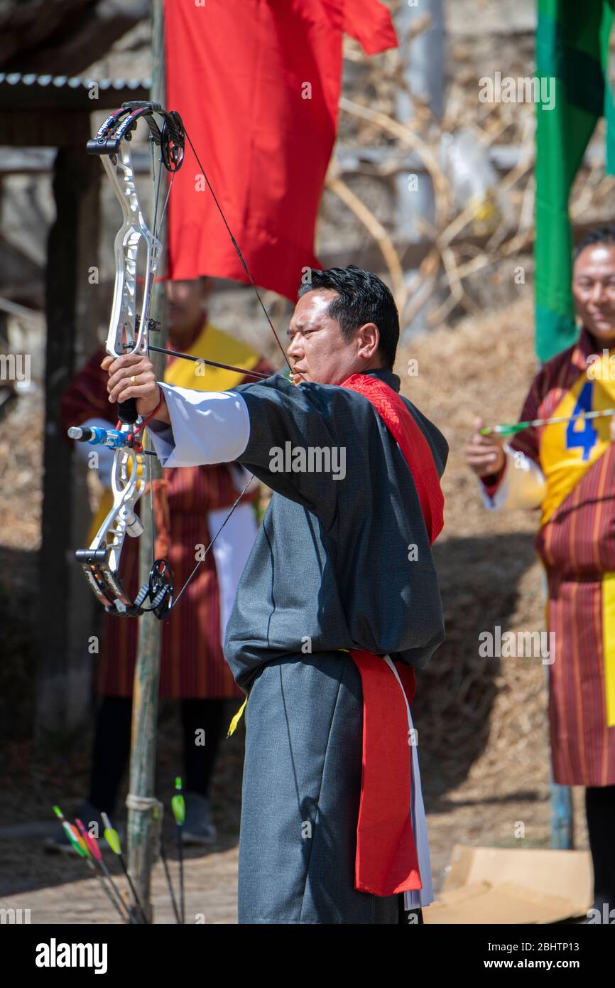 Bhutan, Paro. Archery competition, Bhutan's National sport. Archer in ...