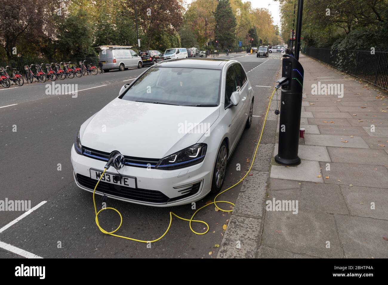 Electric car charging in street, London, England, UK Stock Photo - Alamy