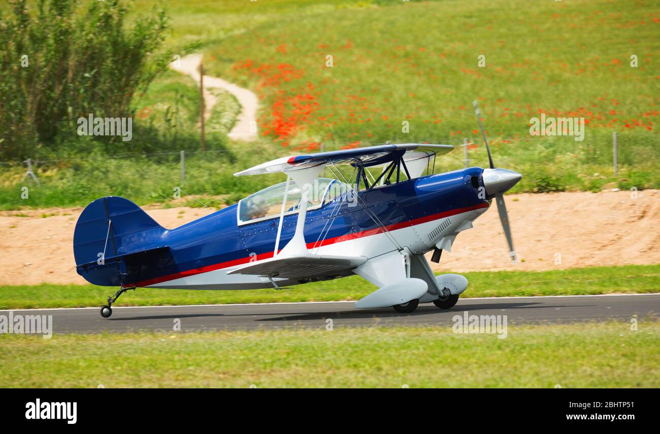 Sport airplane taking up from runway on airfield on summer day Stock ...