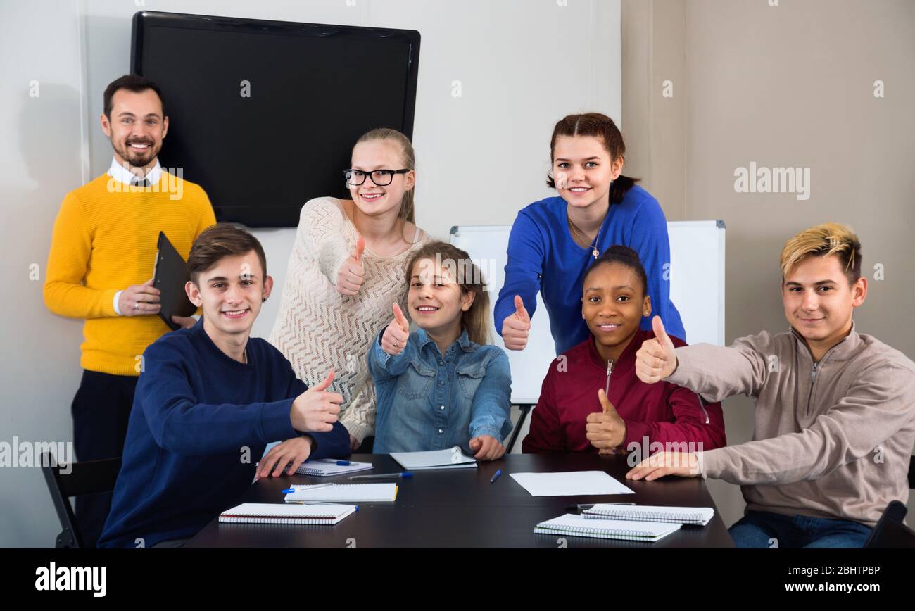 Happy cheerful positive classmates displaying their enjoyment of school ...