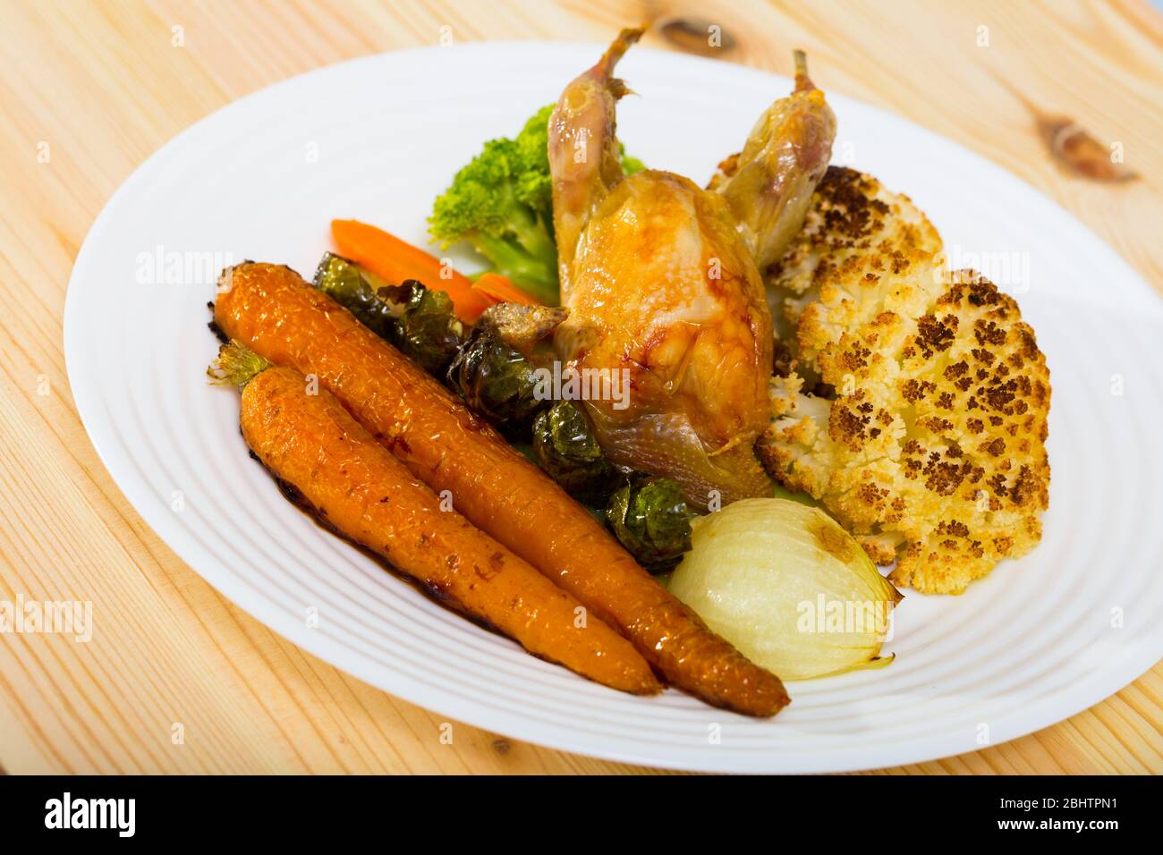 Image of plate with partridge baked with vegetables in honey-mustard ...